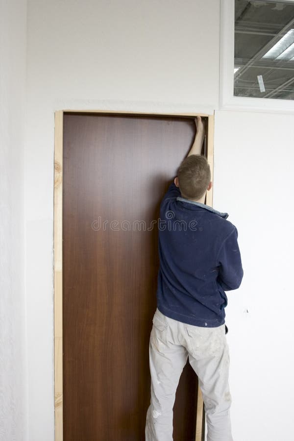 Installing the doors stock photo. Image of worksite, work - 8948934