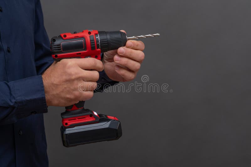 Installing the Drill into the Socket of a Cordless Screwdriver. Stock ...
