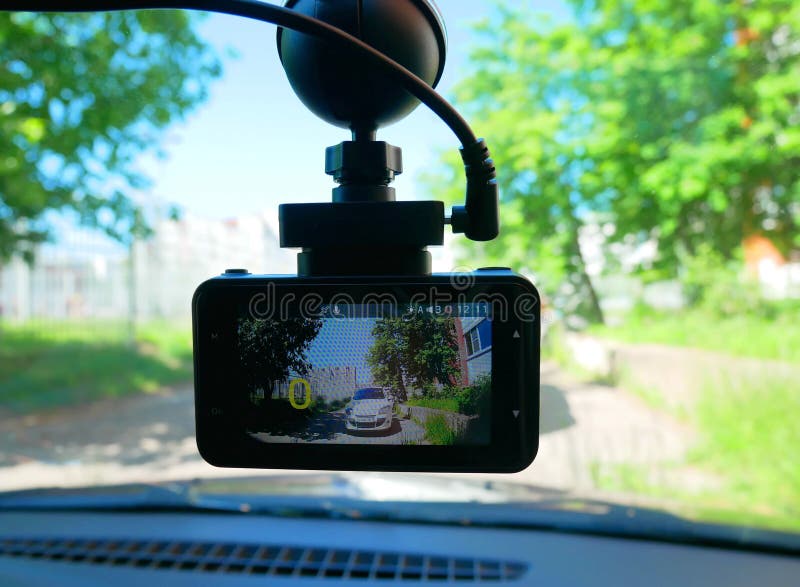 Installing the DVR in the Car. DVR on the Windshield of the Car. Stock ...
