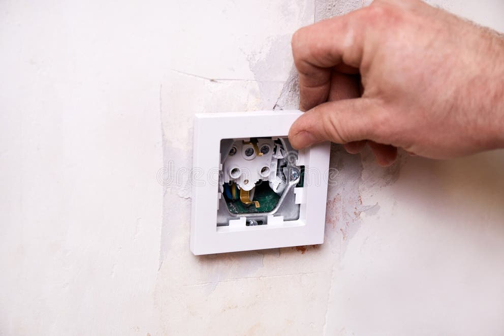 Installing an Electrical Outlet . the Wall Indicates that Renovation ...