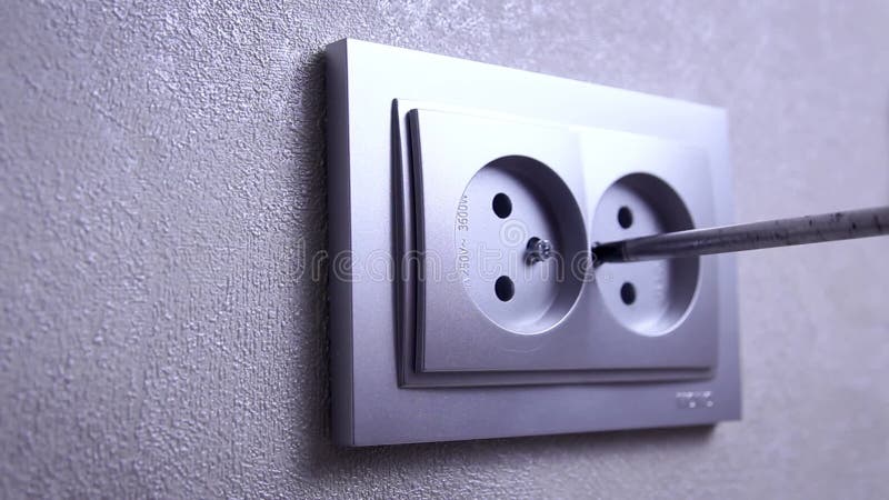 Installing Electrical Outlets. the Electrician Installs a Decorative ...