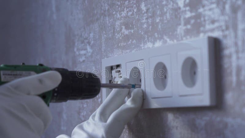 Installing Electrical Wall Outlets with a Screwdriver in a New Home ...