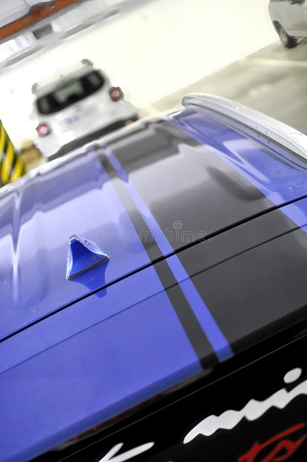 Installing Foil Stickers Decals on a Blue SUV Car in the Garage ...