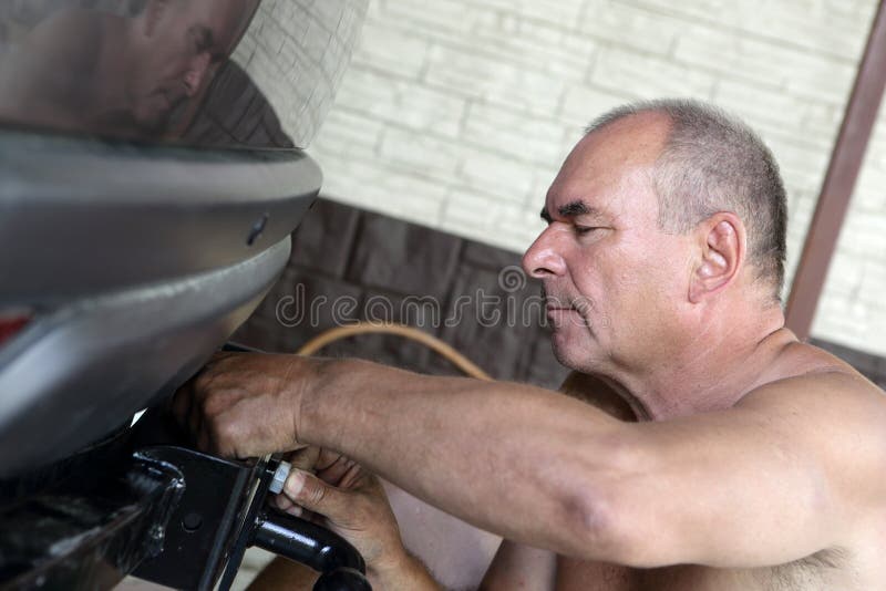 Installing hitch car stock photo. Image of metal, home - 58025310