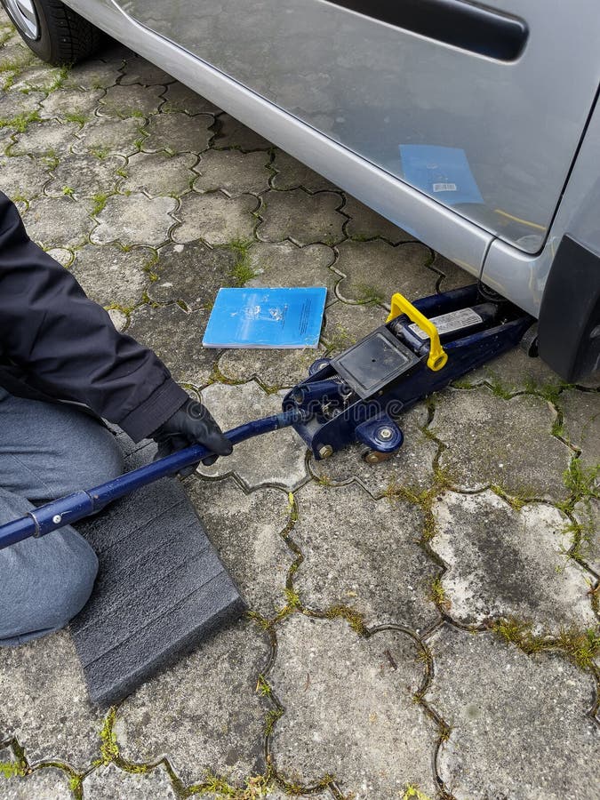 Installing Jack Under Car Lift Changing Wheel Maintenance Stock Photos ...
