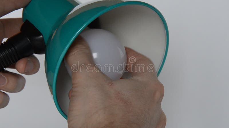Close Up of Caucasian Male Hand Installing a Light Bulb Stock Video ...