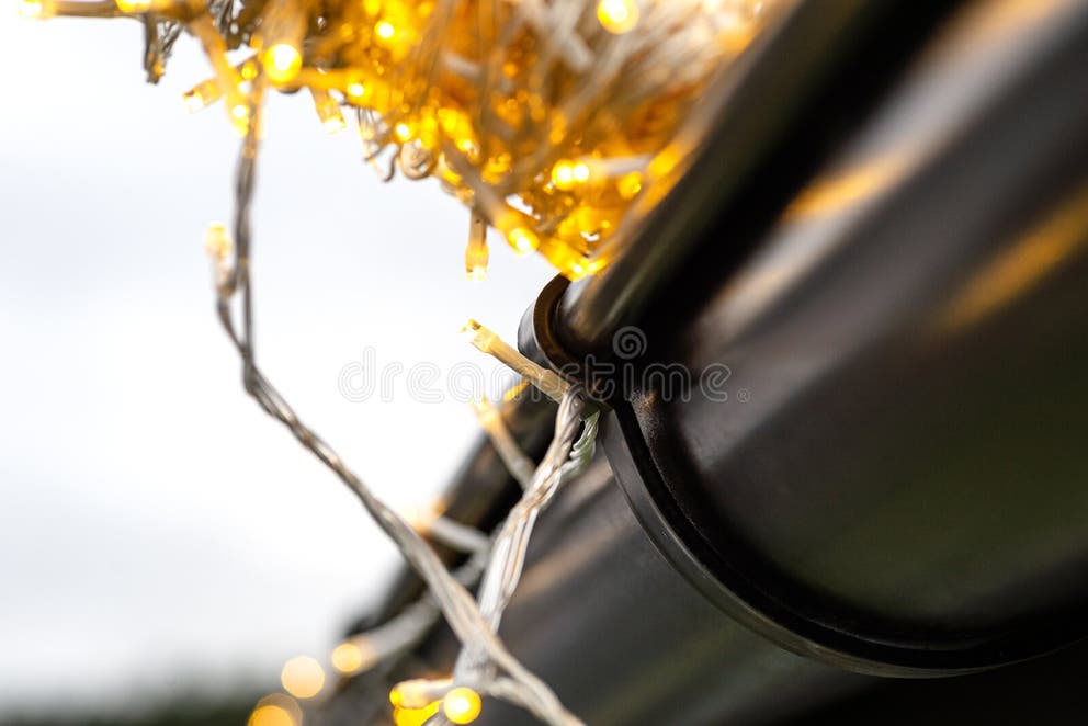 Installing LED Lights Along the Gutter Around the House, Decorating the ...