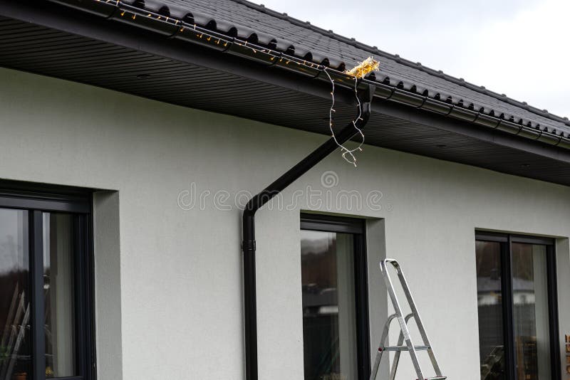 Installing LED Lights Along the Gutter Around the House, Decorating the ...