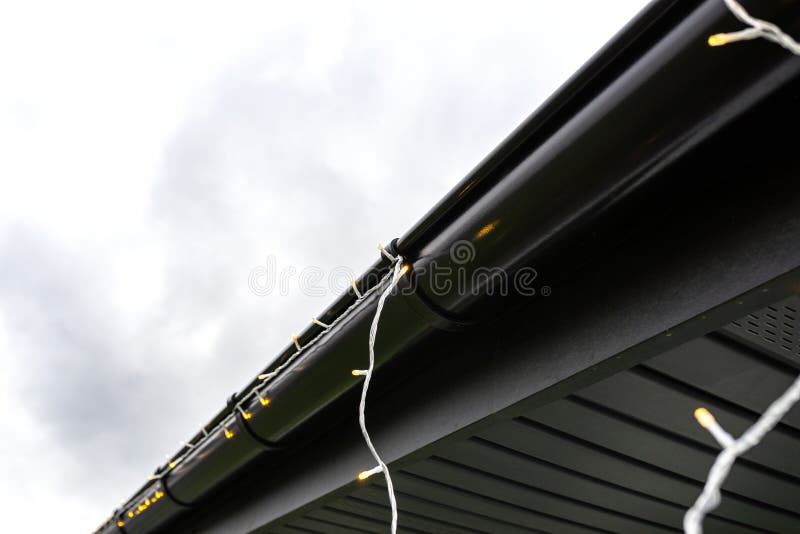 Installing LED Lights Along the Gutter Around the House, Decorating the ...