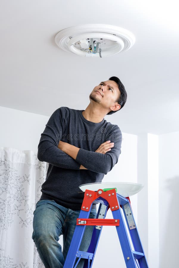 Installing light bulb stock image. Image of lightbulb - 167102981