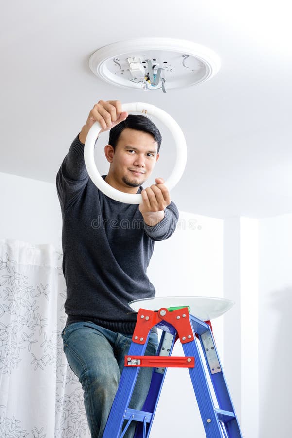 Installing light bulb stock photo. Image of installing - 167103030