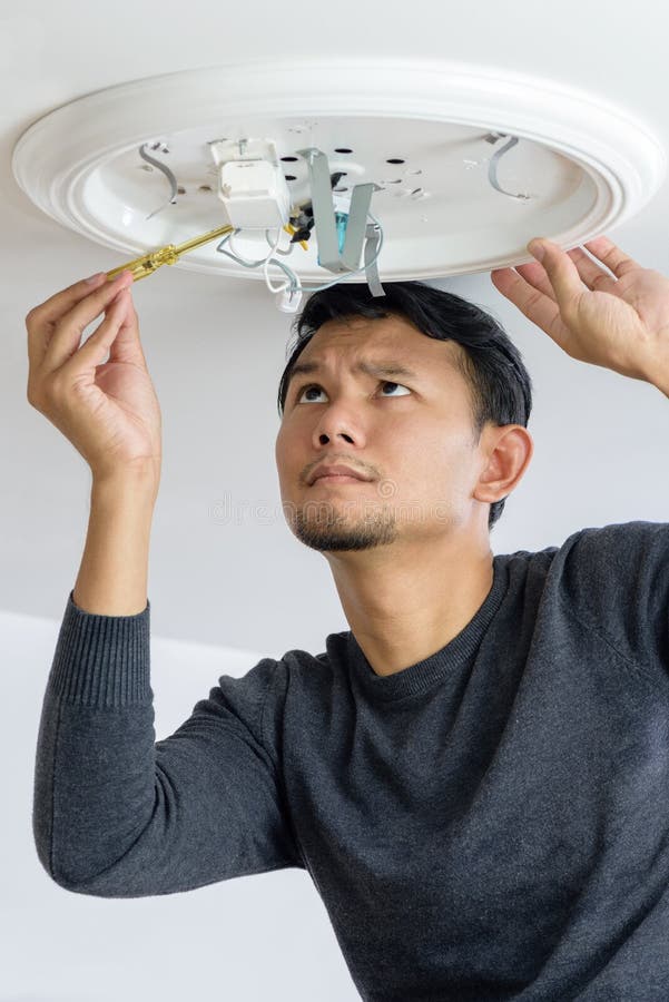 Installing light bulb stock photo. Image of people, service - 167103154