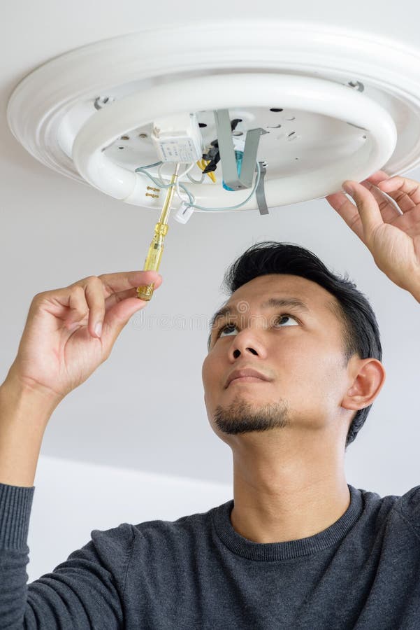 Installing light bulb stock image. Image of repairing - 167103267