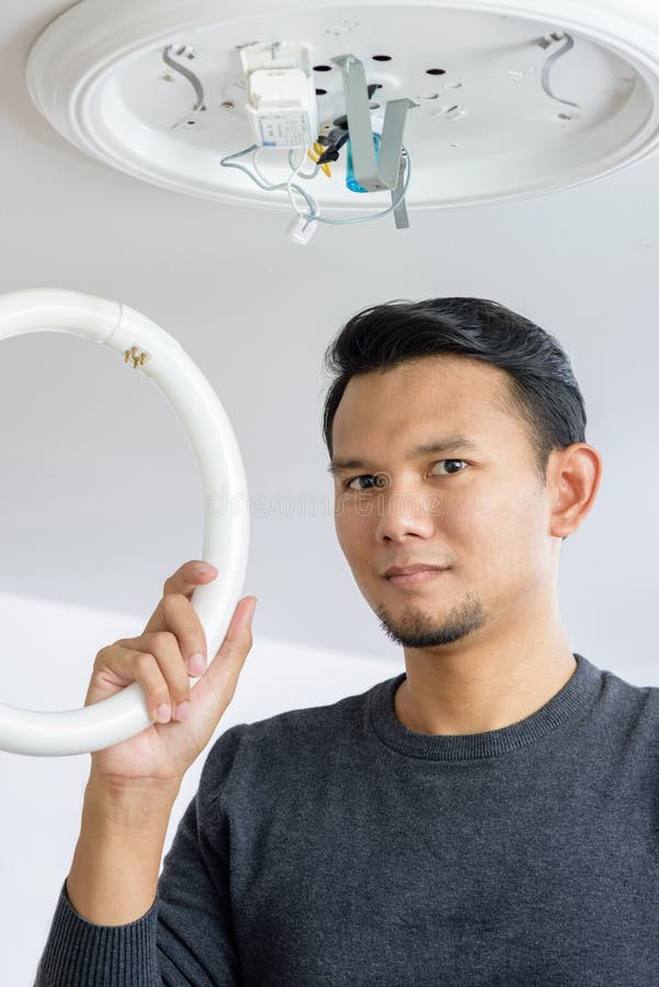 Installing light bulb stock image. Image of home, bulb - 167103307