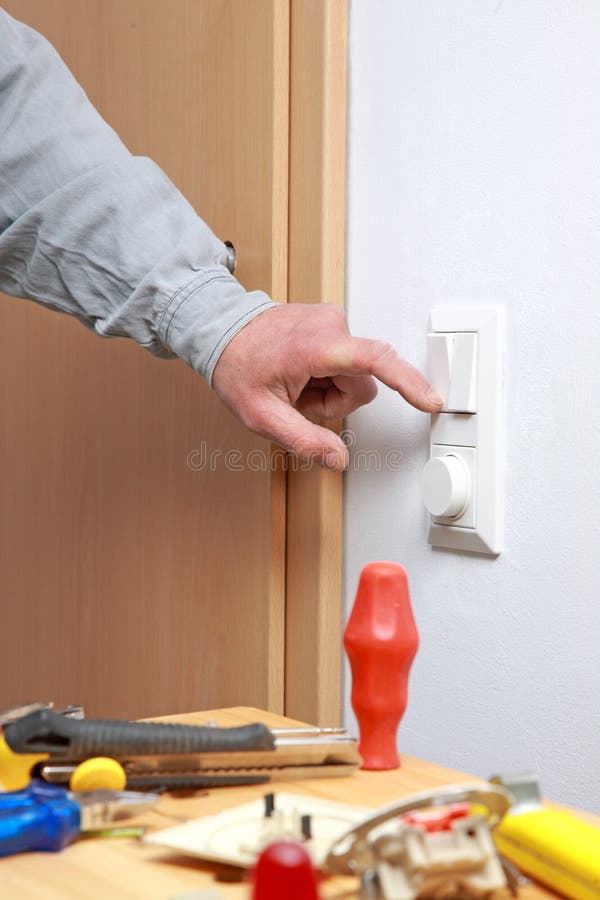 Installing a light switch. stock photo. Image of handle - 16527132