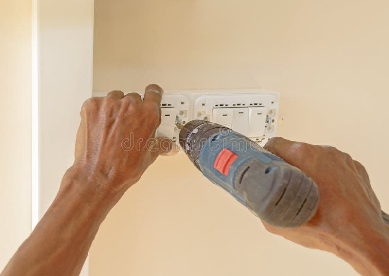 Installing light switch stock photo. Image of room, decor - 104158816