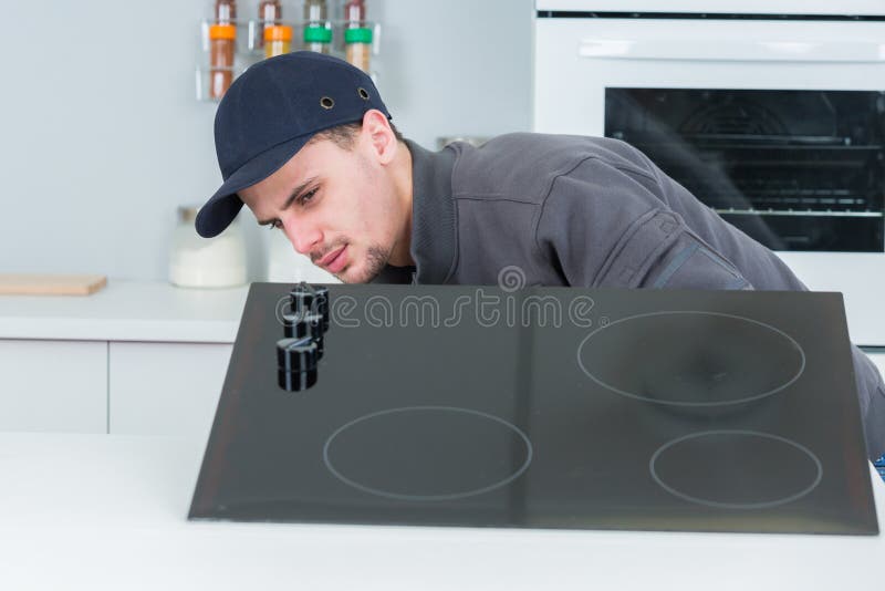 Installing New Induction Hob in Clients Kitchen Stock Photo - Image of ...
