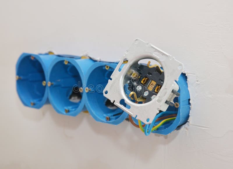 Installing of a New Multiple Socket Electrical Outlet Connecting the ...