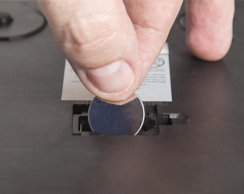 Installing a New Round Coin Cell Battery in an Electrical Appliance ...