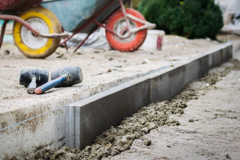 Installing Curbstone on Street Stock Photo - Image of cement, street ...