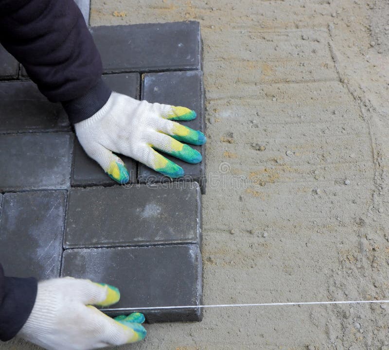 Installing paving slabs stock photo. Image of flat, front - 62937916