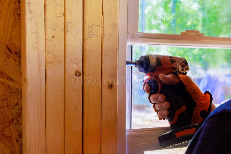 Installing Plastic Windows with Screwdriver in New Home by a ...