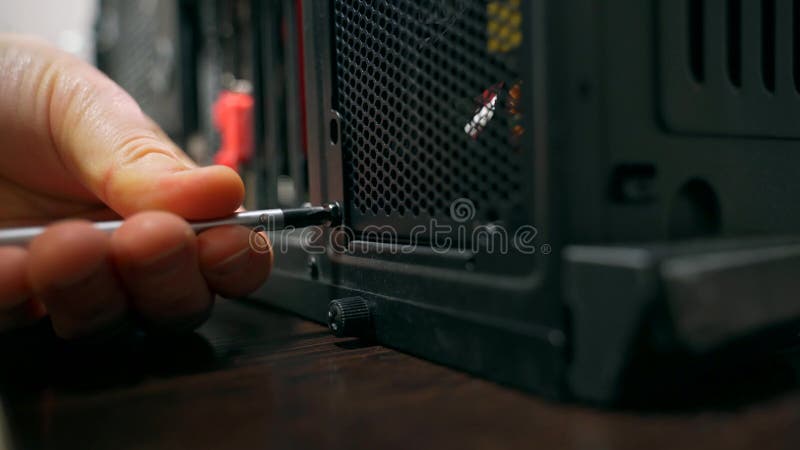 Installing the Power Supply in the System Unit of the Computer. Stock ...