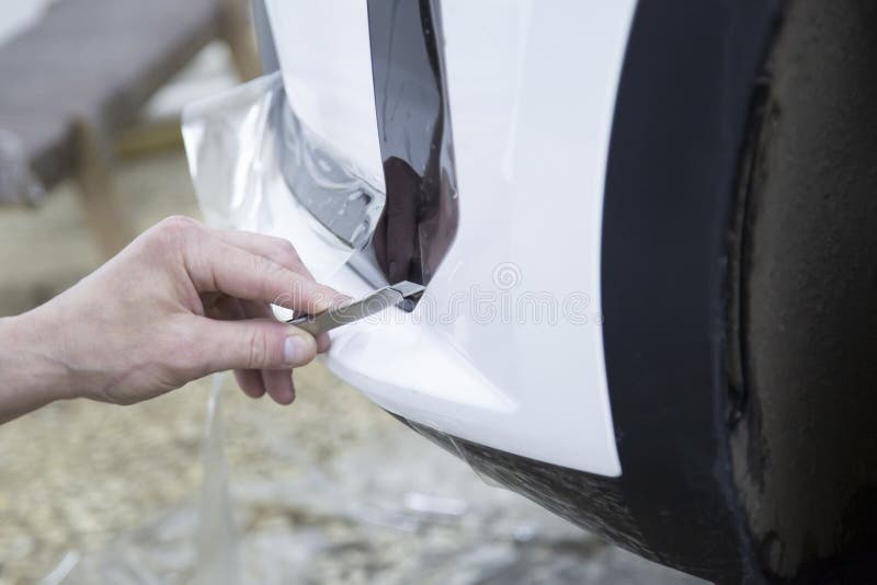 Installing a Protective Film on the Car.Protection of the Paintwork of ...