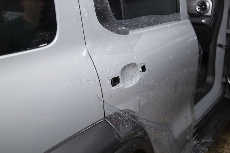 Installing a Protective Film on the Car.Transparent Paint Protection ...