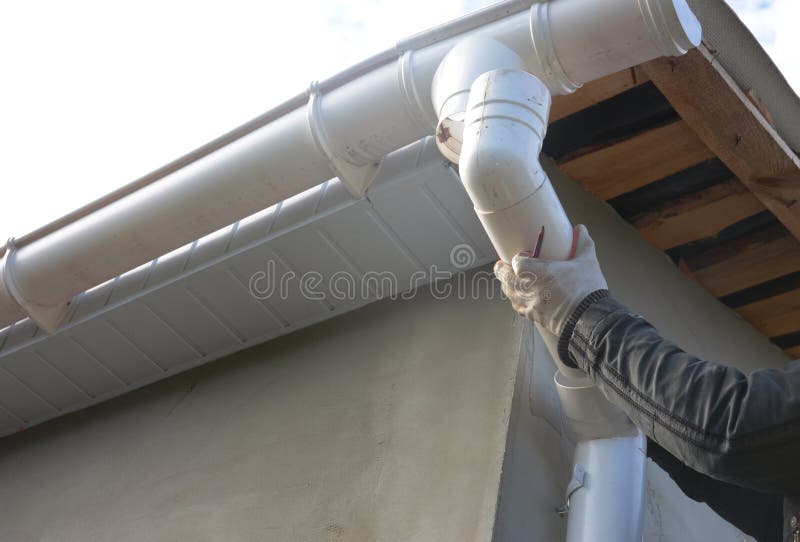 Installing rain gutter stock photo. Image of male, roof - 2646262