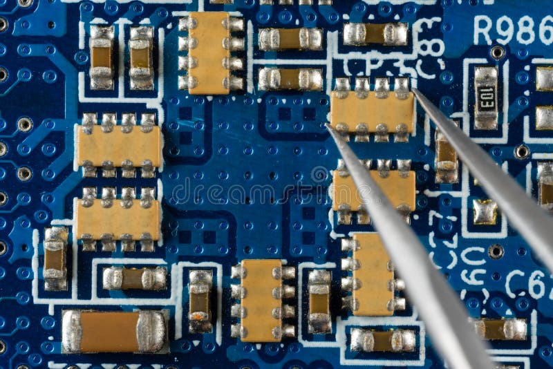 Installing or Removing Electronic Components on a Blue Electronic Board ...