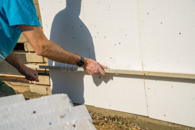 Installing Rigid Styrofoam Insulation Board for Energy Saving of the ...