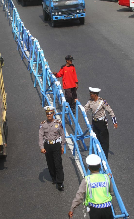 Installing roadblock editorial stock photo. Image of indonesia - 32540623