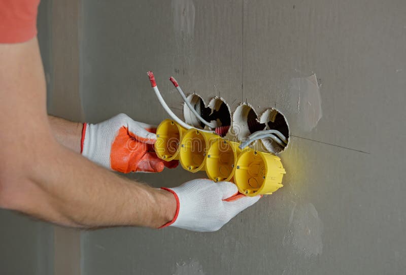 Installing Socket Boxes into Drywall Stock Photo - Image of group ...