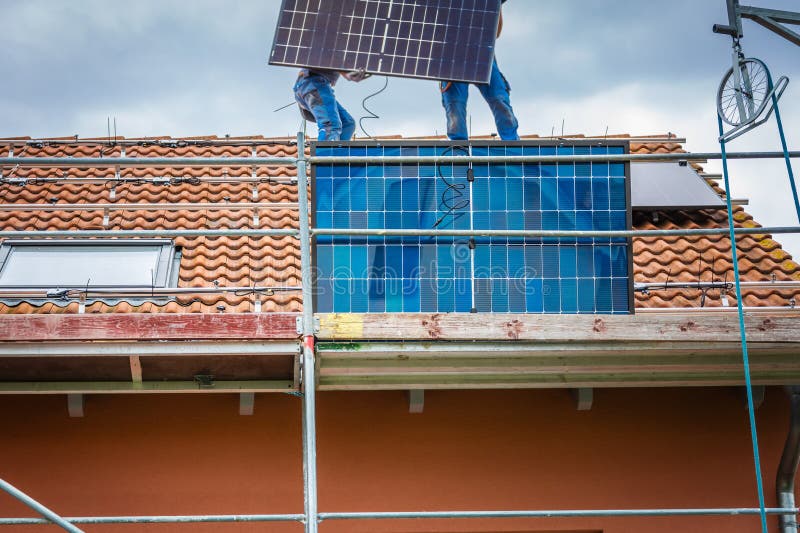 Installing Solar Panels on a Roof. Solar Panels on Roof Stock Image ...