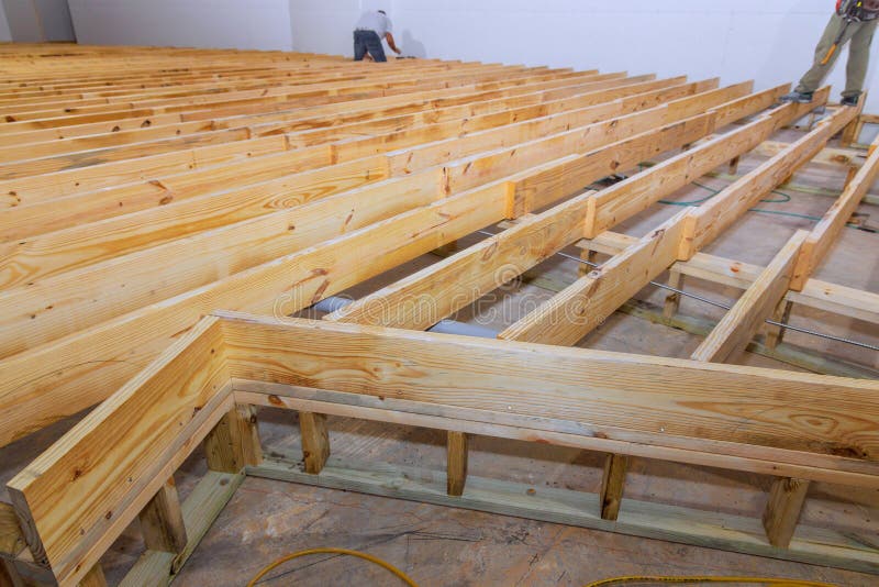 Installing a Stage Indoors Using Wooden Frame Beams Mounted on Wooden ...