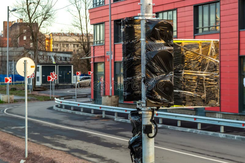 Installing Traffic Lights. the New Traffic Light is Wrapped in Black ...