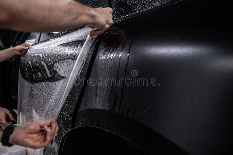 Installing Transparent PPF Film on a Matte Black Car Fender Stock Image ...