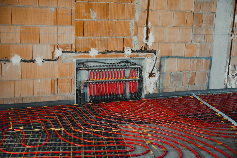Installing Underfloor Heating System in New Home with Brick Wall Stock ...
