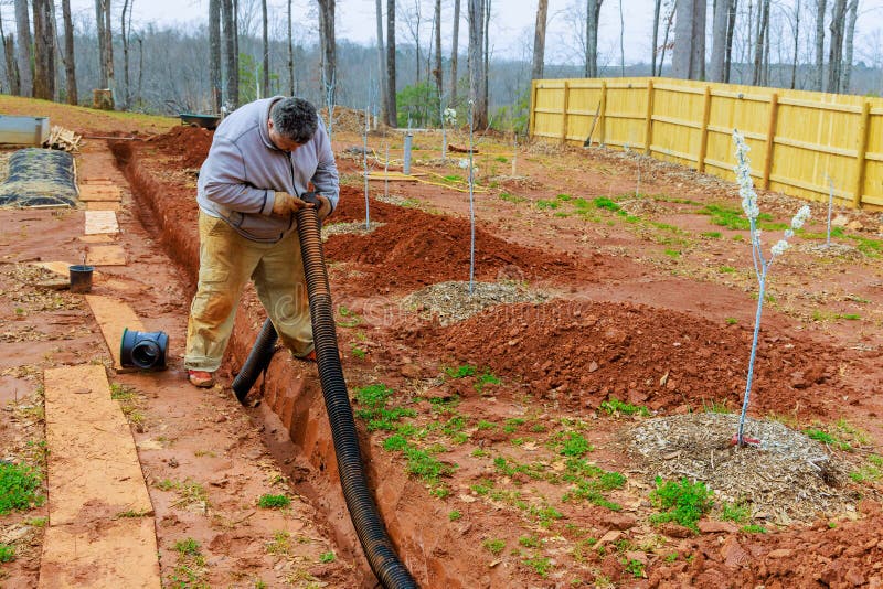 Installing Underground Drainage System for Outflow of Rainwater ...