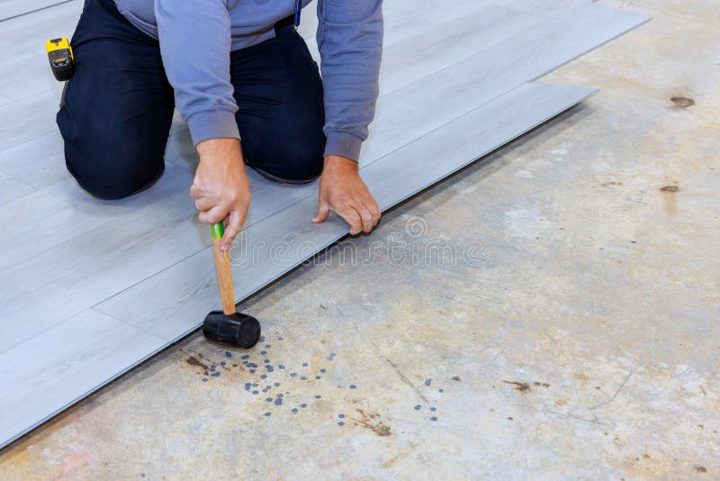 Installing Vinyl Plastic Siding Panels on Facade of a New House by an ...