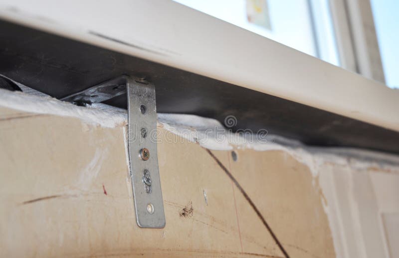 Installing a Window Sill in a New House. Close Up on Window Sill Holder ...