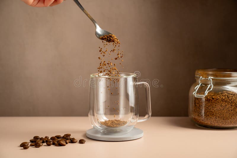 Instant Coffee Pouring in Transparent Glass Mug, Roasted Coffee Beans ...