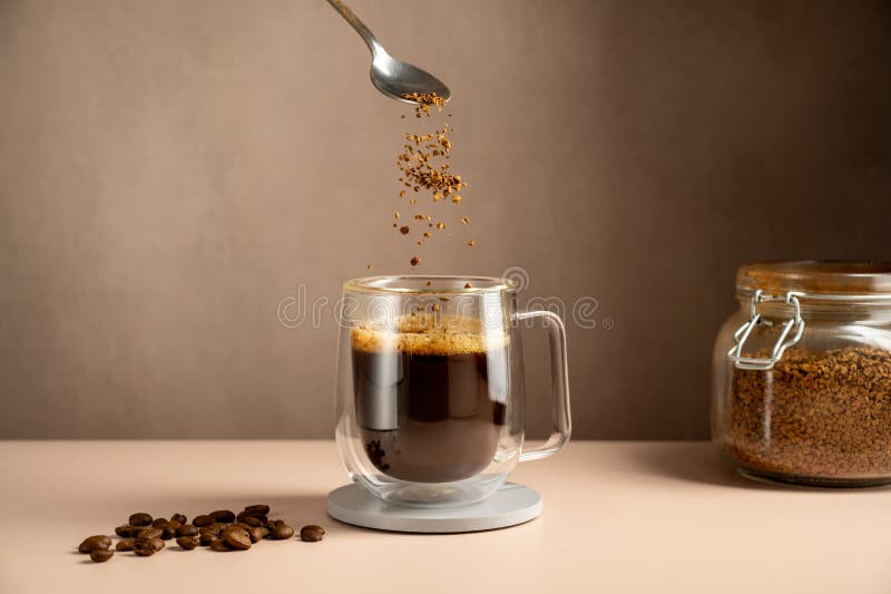 Instant Coffee Pouring in Transparent Glass Mug, Roasted Coffee Beans ...