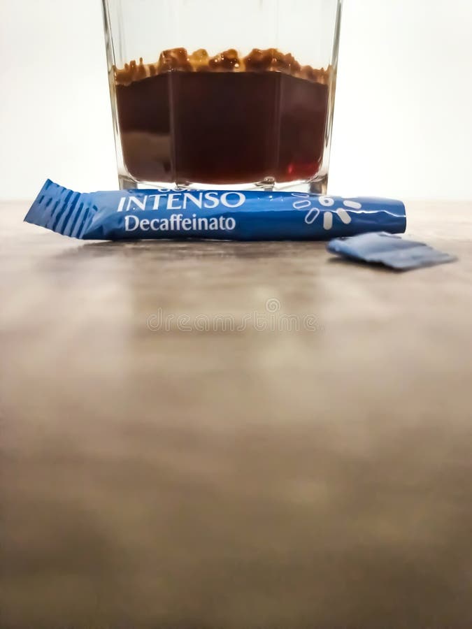 Instant Decaffeinated Coffee Sachet and Coffee in Transparent Glass ...