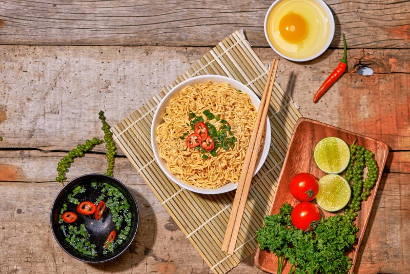 Instant Noodles in Bowl with Vegetable on Wooden Table. Stock Image ...