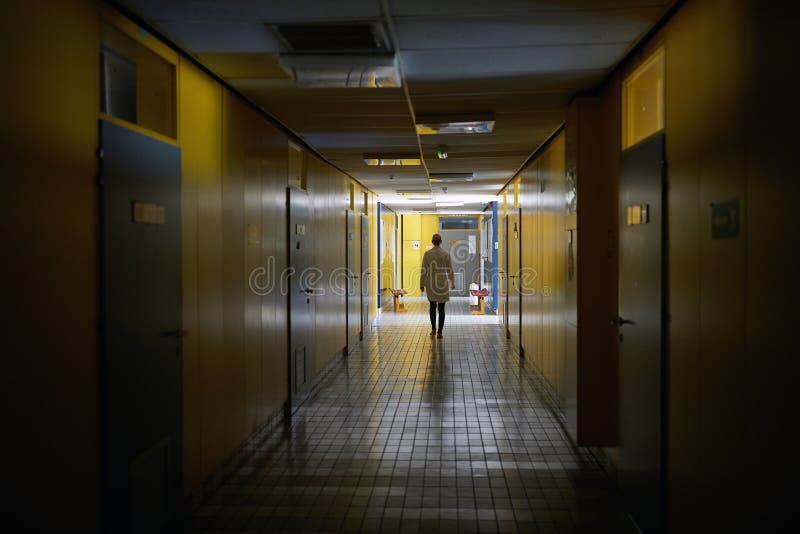 An Institution Employee Walking a Hallway. Institution, Hallway ...