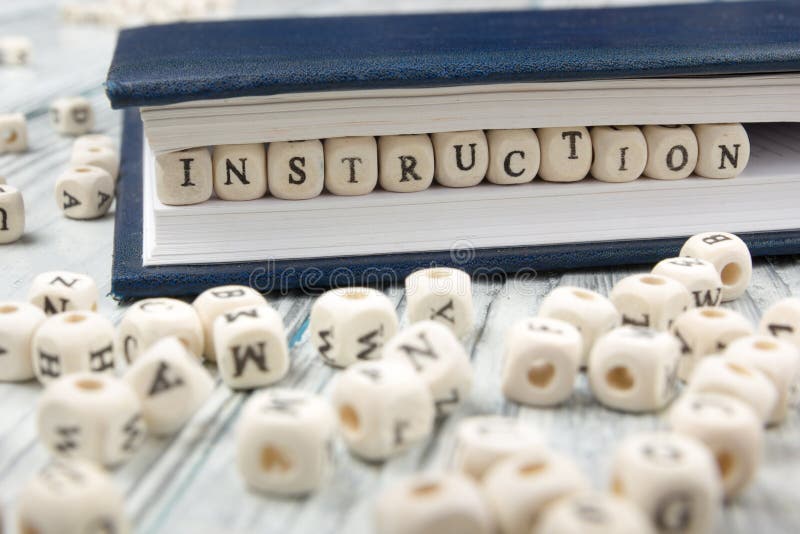 Instruction Text on a Wood Blocks at Wooden Table Stock Image - Image ...