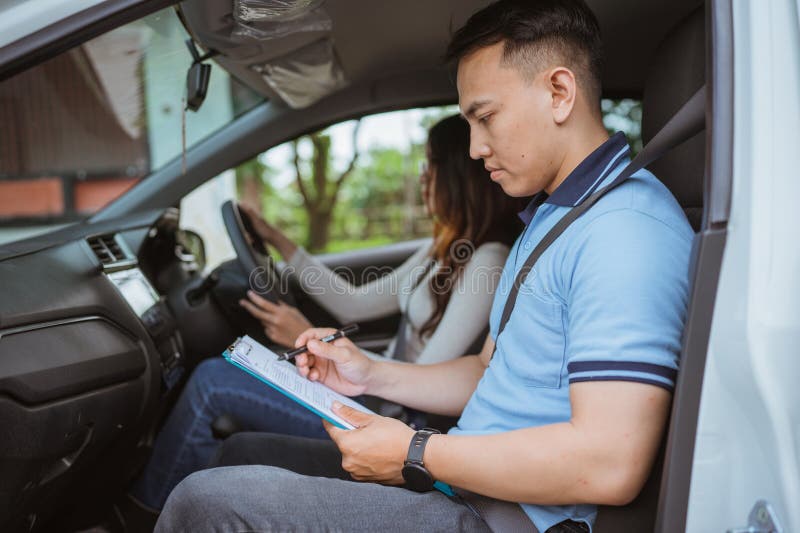 An Educational Driving Lesson between an Instructor and a Student in a ...