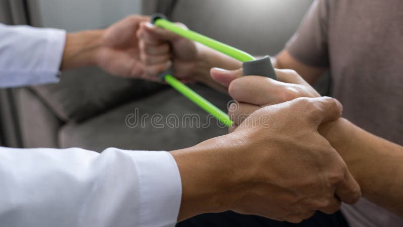 Instructor Assisting Senior Doing Exercise Working Out in Clinic ...